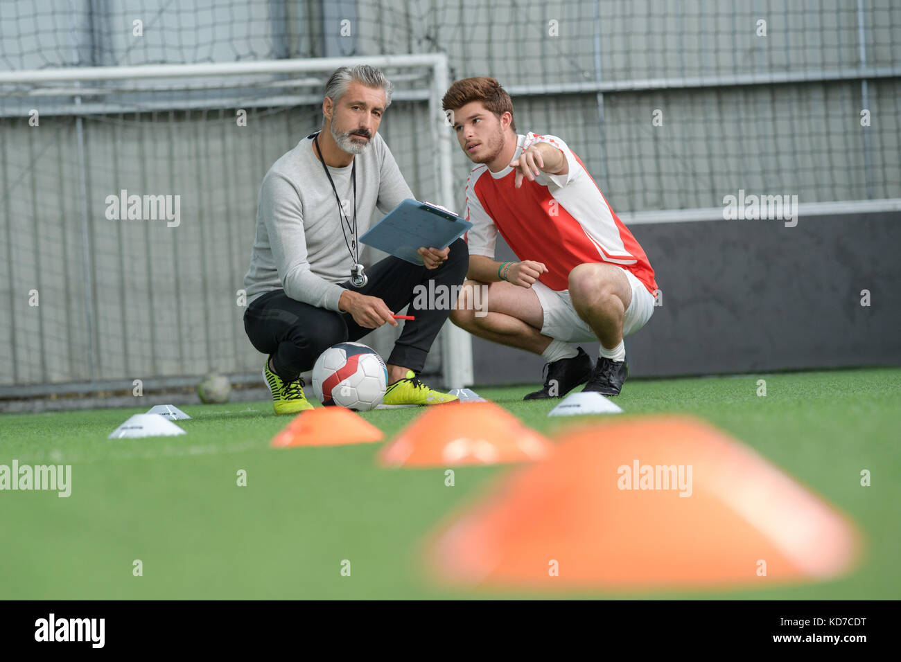 coach and futsal player Stock Photo - Alamy