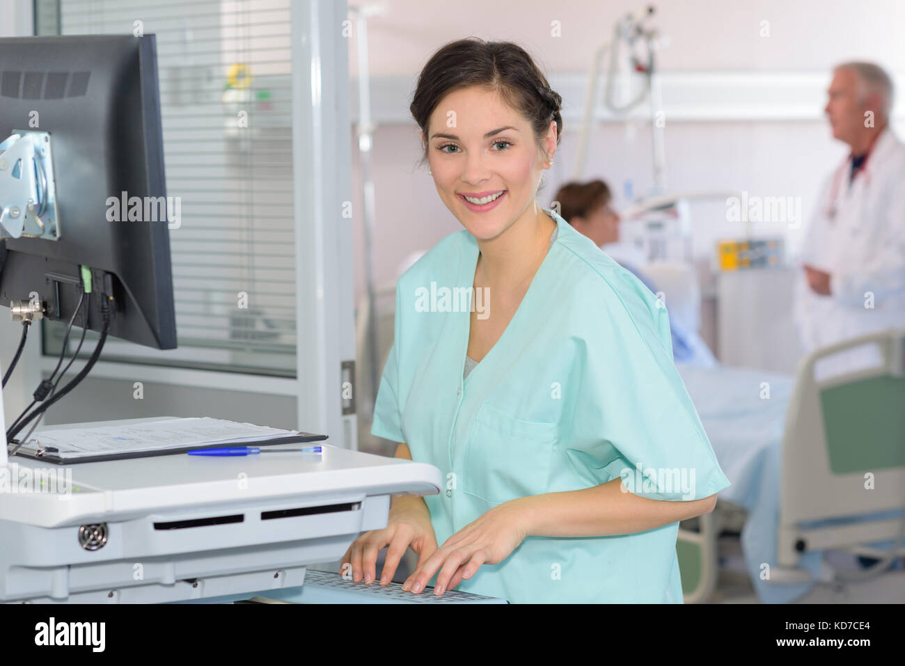 medical assistant typing in the computer Stock Photo - Alamy