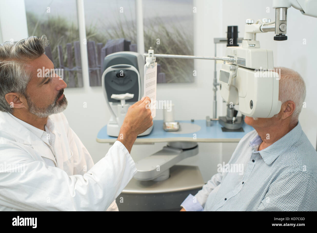 senior man having eye examination Stock Photo - Alamy