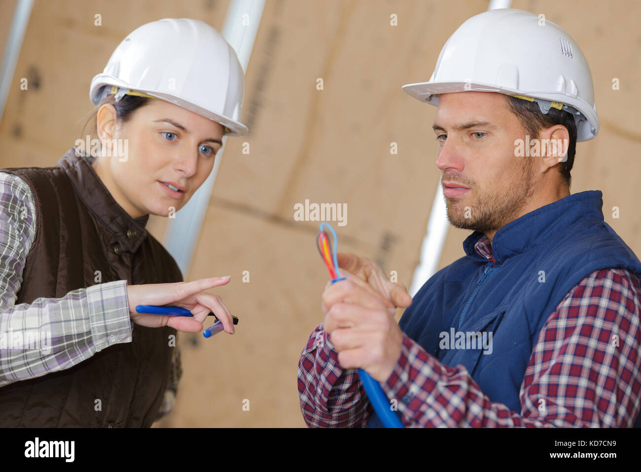 electricians talking about cables Stock Photo - Alamy