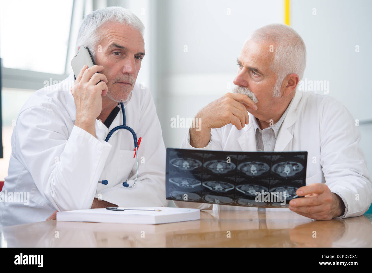 Senior medical practitioners checking hi-res stock photography and ...