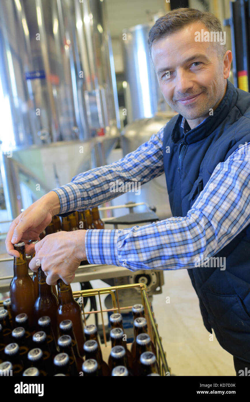 worker at a beer bottling factory Stock Photo - Alamy
