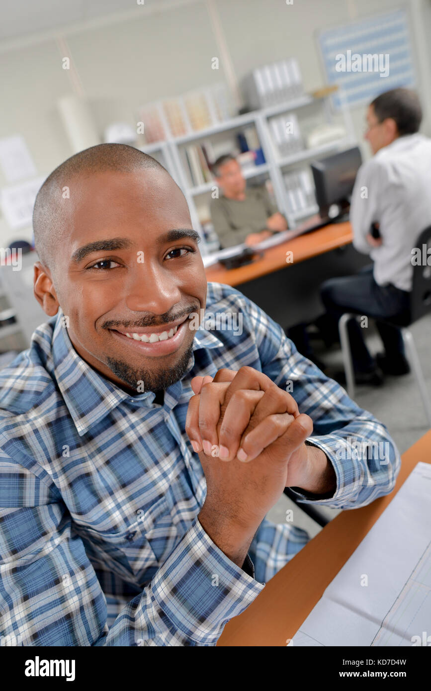 Cheerful male office worker Stock Photo - Alamy