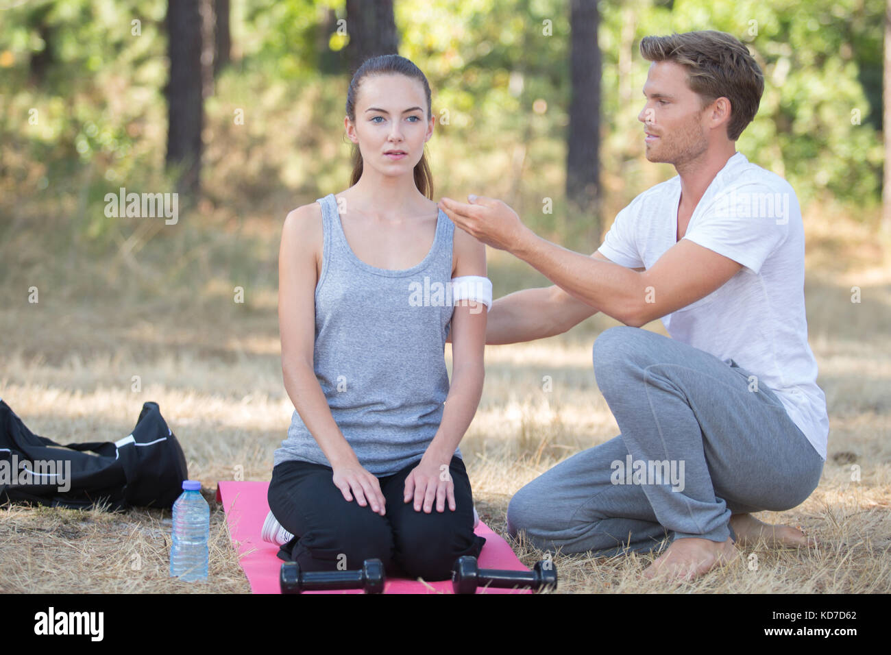 personal trainer checking the position Stock Photo - Alamy