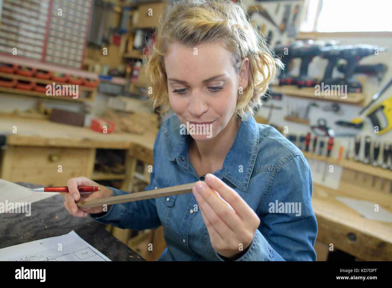 female carpenter works in a workshop Stock Photo - Alamy