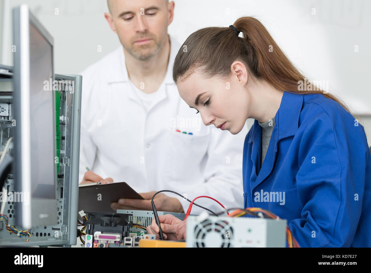 female pc technician next to teacher Stock Photo - Alamy