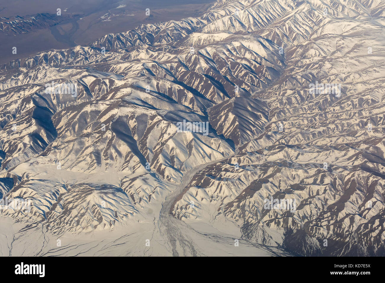 Mongolia aerial view of mountains covered with snow in the spring stock ...