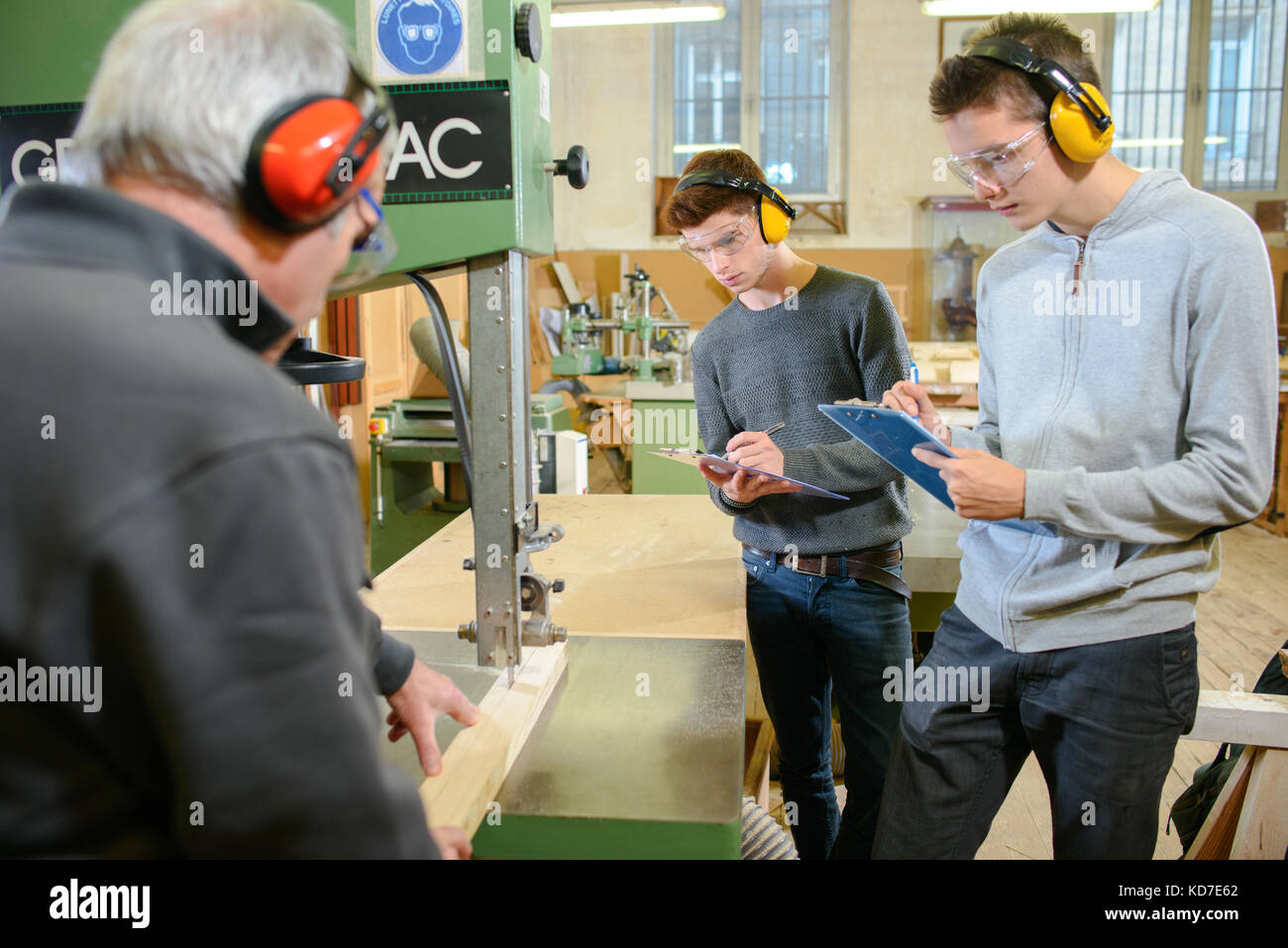 young male engineers in factory using milling machine Stock Photo - Alamy