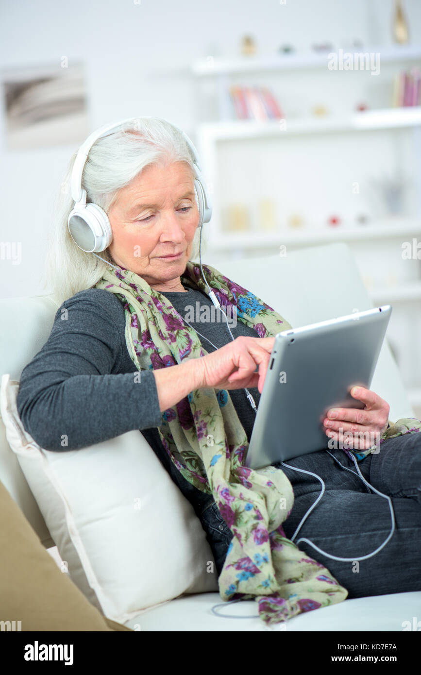 old woman using tablet Stock Photo - Alamy