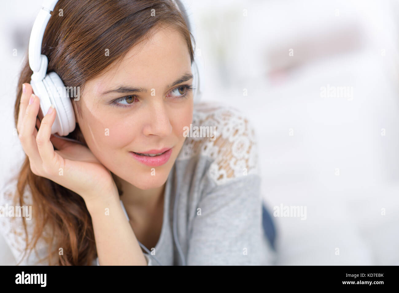 Lady listening to headphones Stock Photo - Alamy