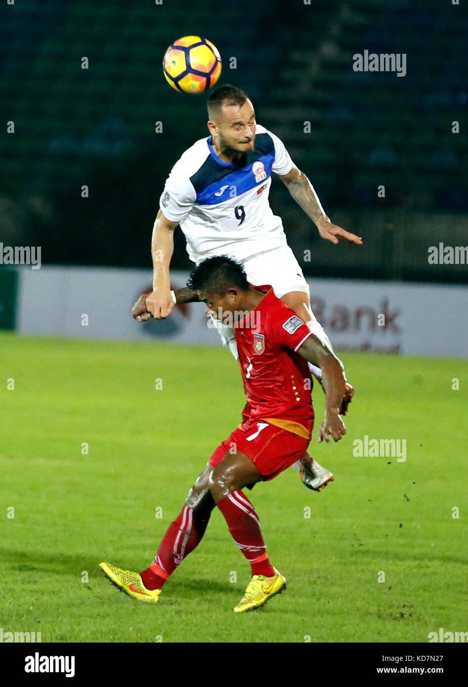 Yangon, Myanmar. 10th Oct, 2017. Tin Win Aung (Bottom) of Myanmar vies for the ball during the ...