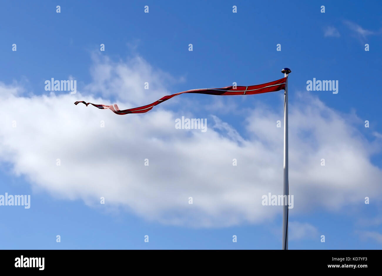 Long Flag of Denmark against blue sky Stock Photo - Alamy