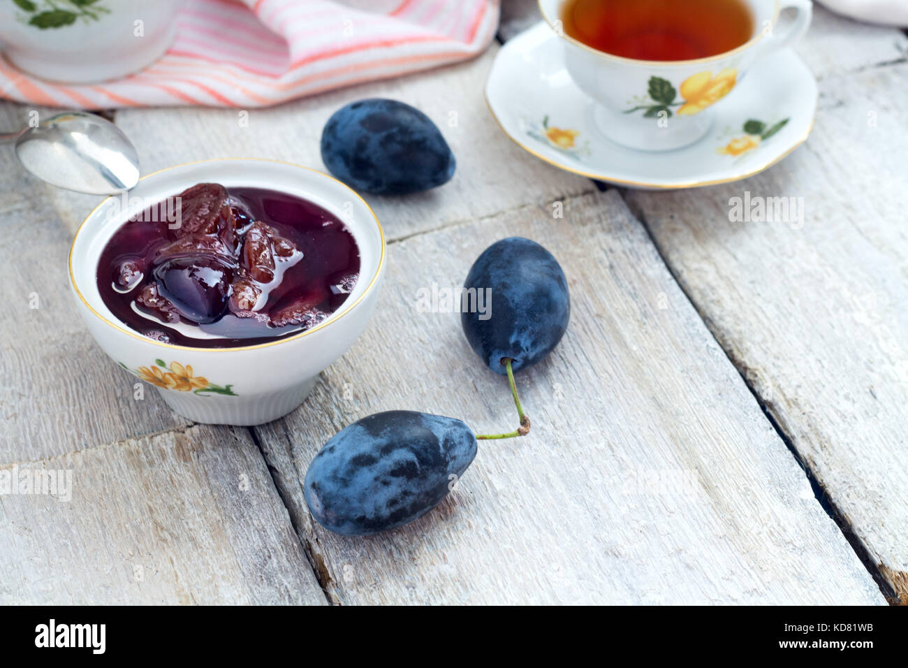 Plum Jam on rustic wooden background Stock Photo - Alamy