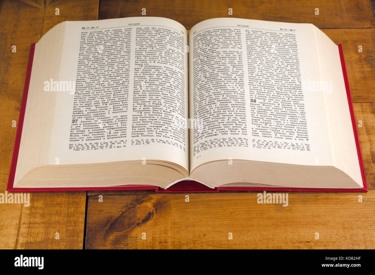 Composition with vintage old hardback books on wooden desk table ...