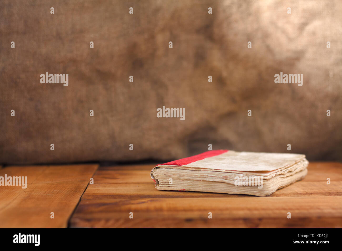 Old Vintage book on dark wooden background Stock Photo - Alamy
