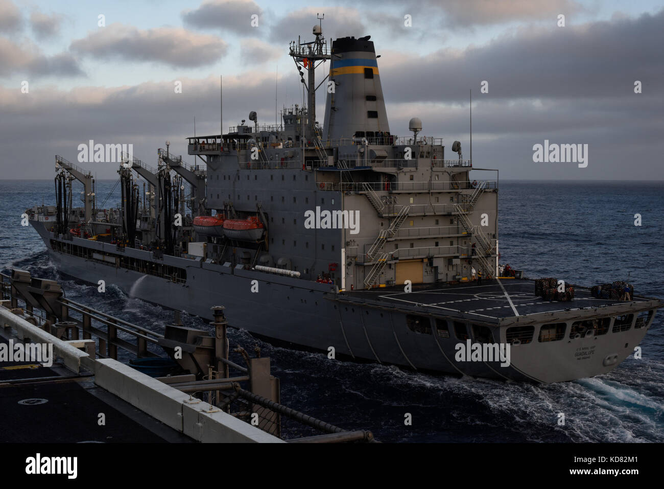 The fleet replenishment oiler USNS Guadalupe (T-AO 200) pulls alongside ...