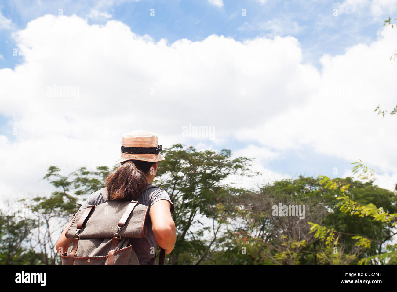 Back woman backpack looking sunset hi-res stock photography and images ...
