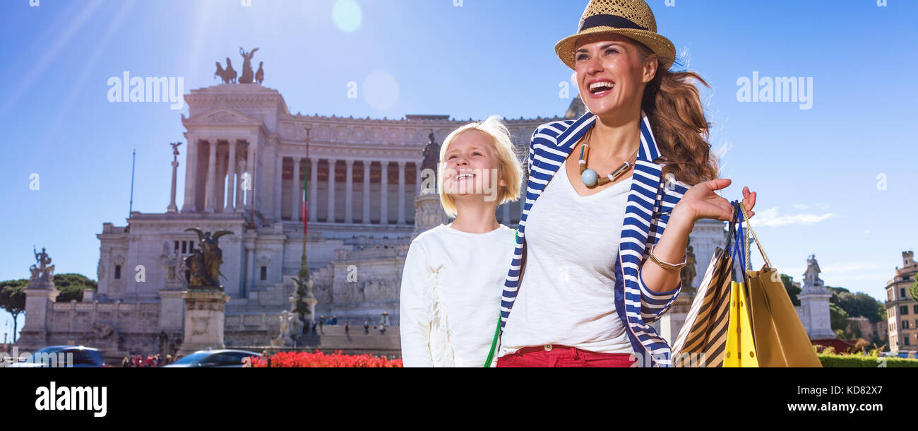 Roman Holiday. happy modern mother and child travellers in the front of ...
