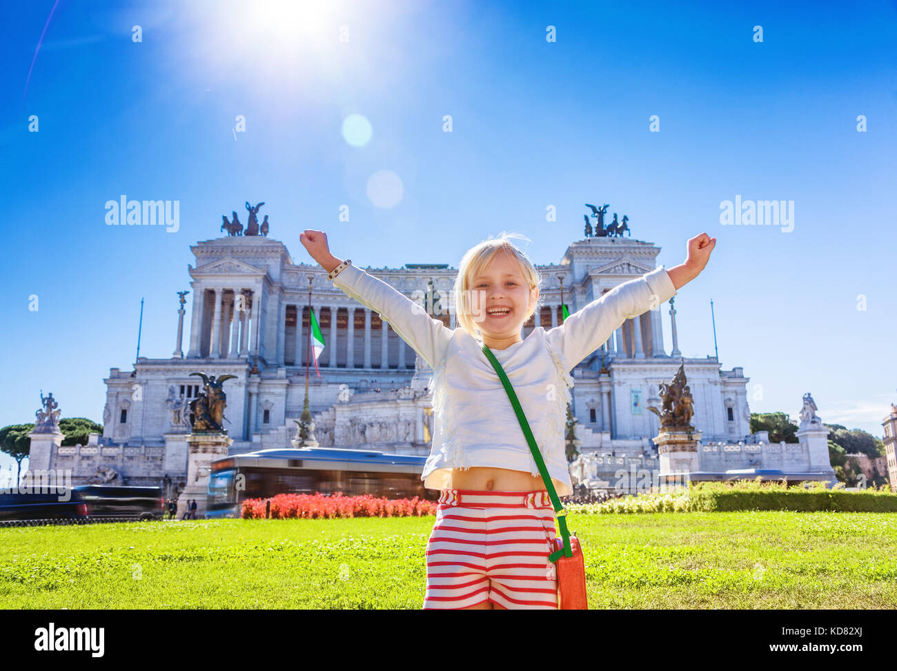 Roman Holiday. Portrait of smiling stylish child in the front of ...