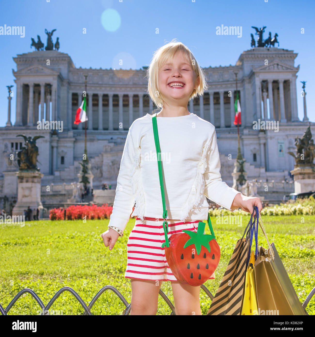 Roman Holiday. Portrait of happy modern girl in the front of Palazzo ...