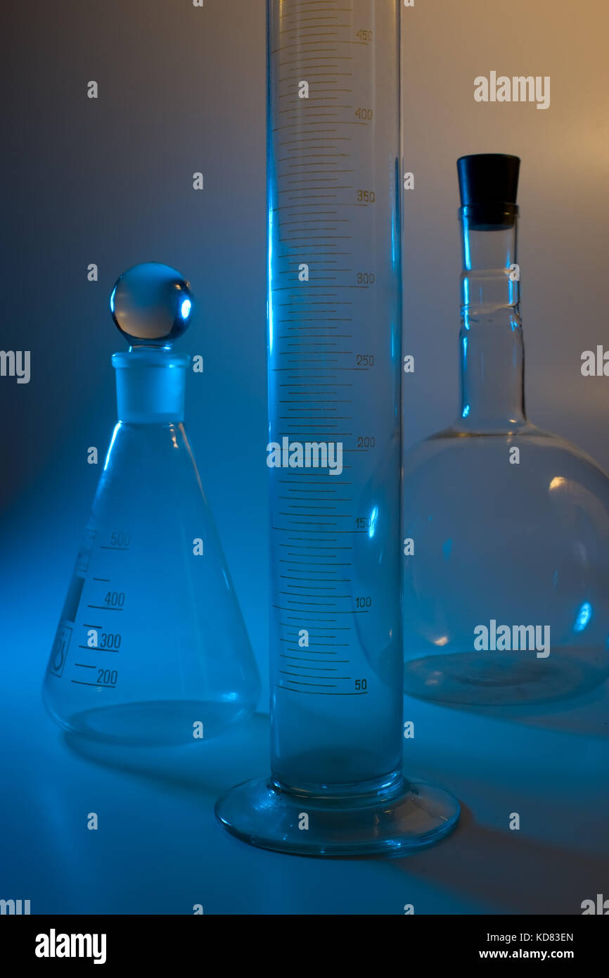 chemical glassware in multicolored lights Stock Photo - Alamy