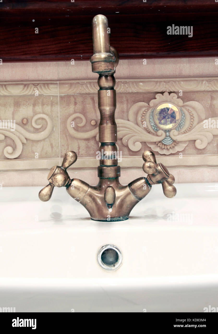 closeup detail to a retro style bronze water tap Stock Photo - Alamy