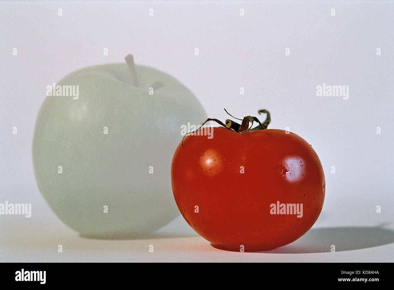 double exposure of apple and tomato Stock Photo - Alamy