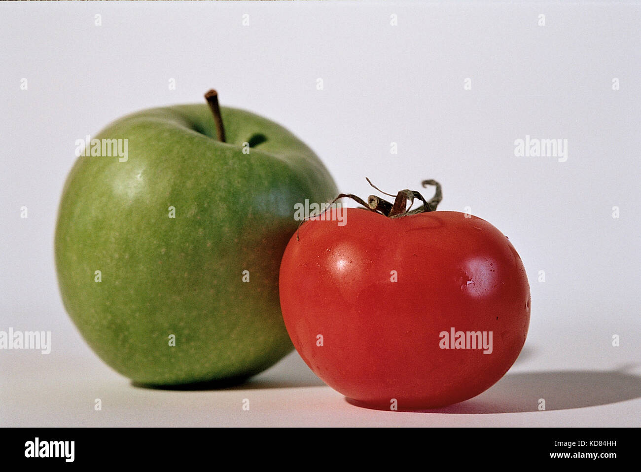 double exposure of apple and tomato Stock Photo - Alamy