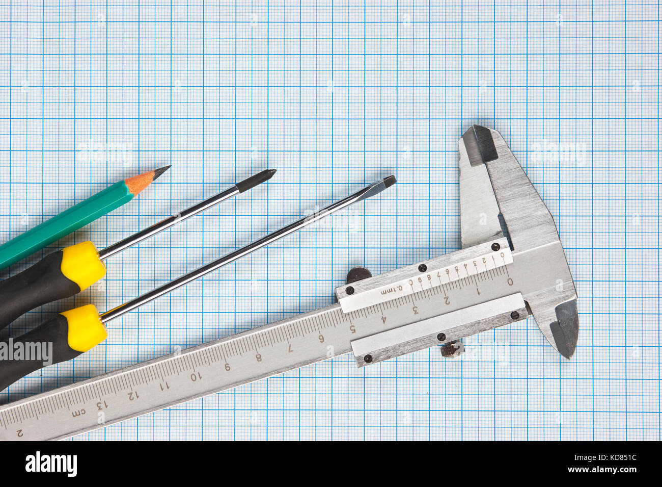 technical tools on a background of graph paper Stock Photo - Alamy