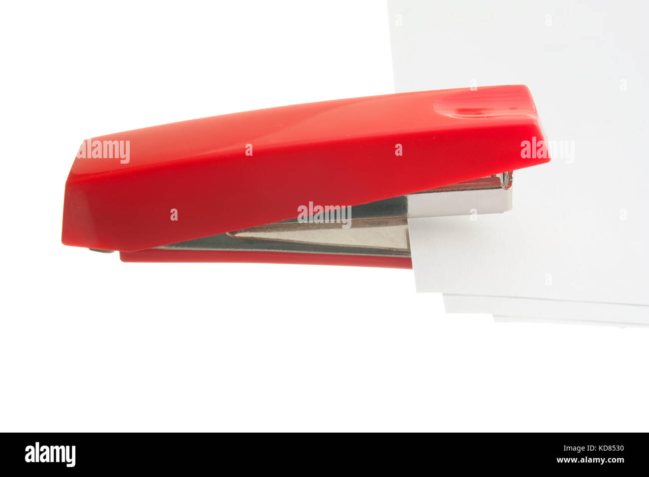 red stapler isolated on white background Stock Photo - Alamy