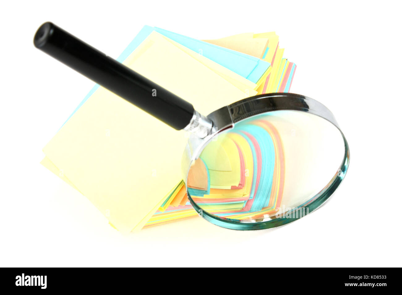 magnifying glass and a stack of paper for notes Stock Photo - Alamy