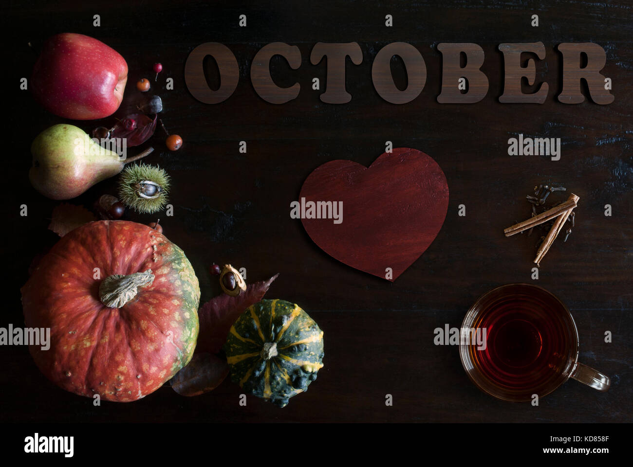 beautiful rustic fall flat lay with leaves, pumpkins, chestnuts, cup of ...