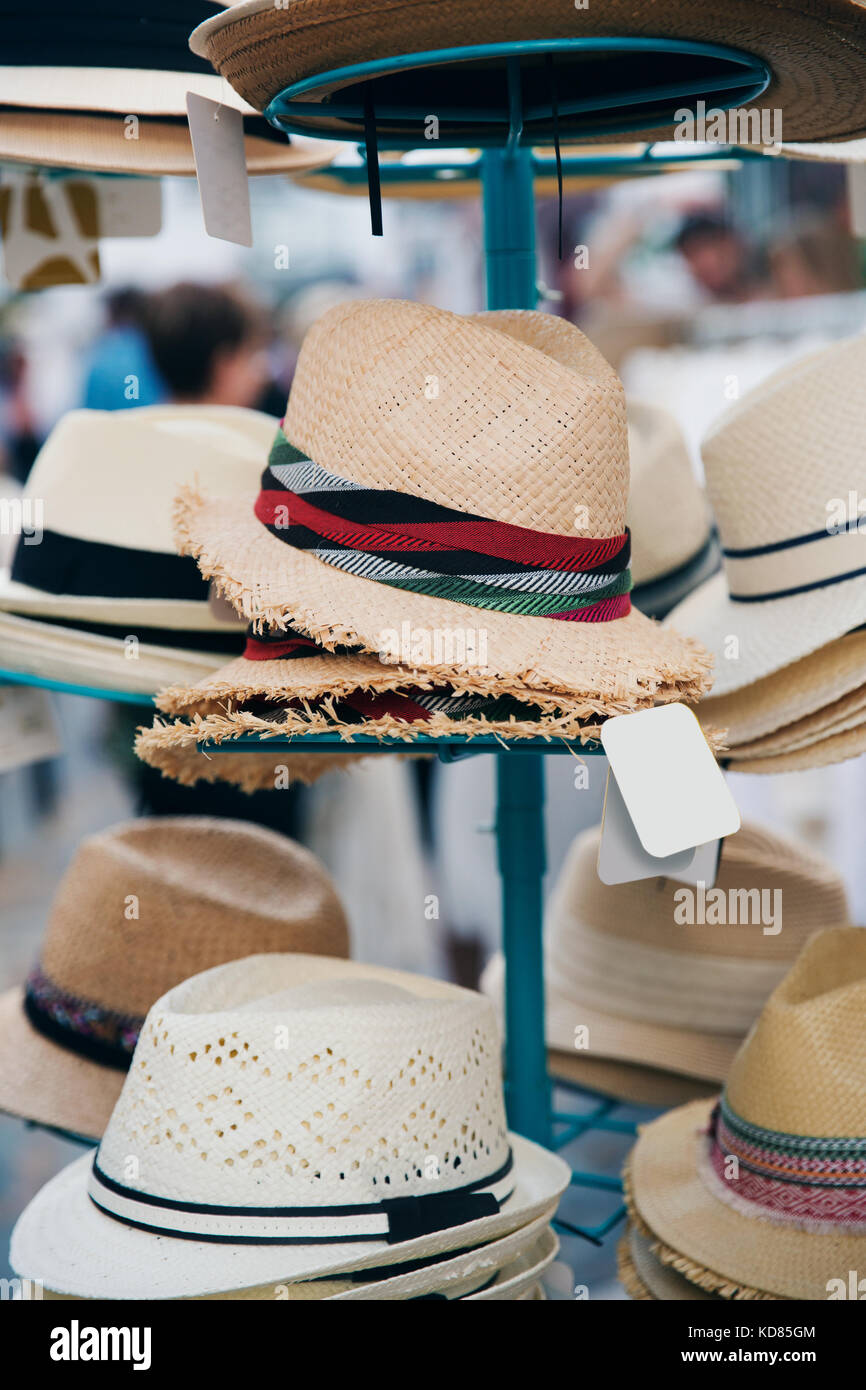 Straw hats for sale in a market Stock Photo - Alamy