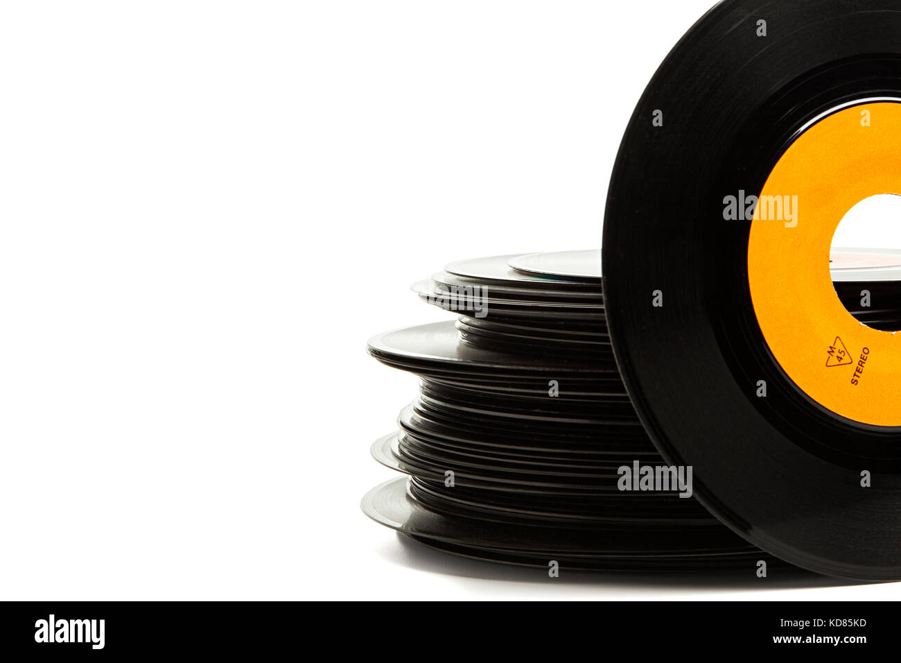 Stack of old single vinyl records, one upright in front with copy space ...