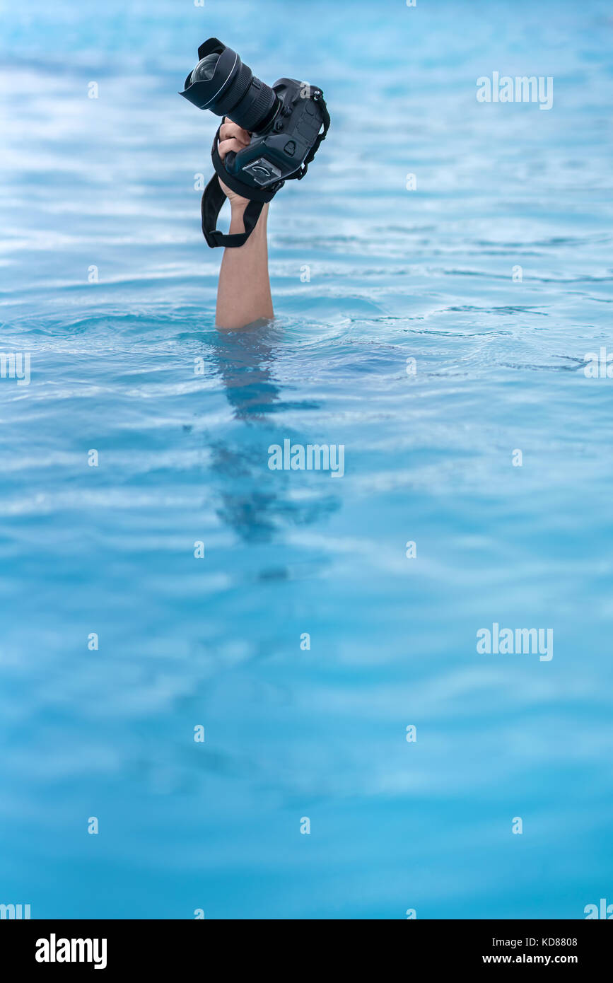 Hand with camera over geothermal pool outdoors Stock Photo - Alamy