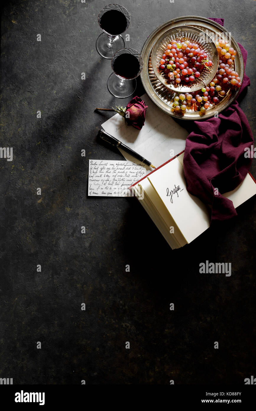 Grapes and Wine with a writing book Stock Photo - Alamy