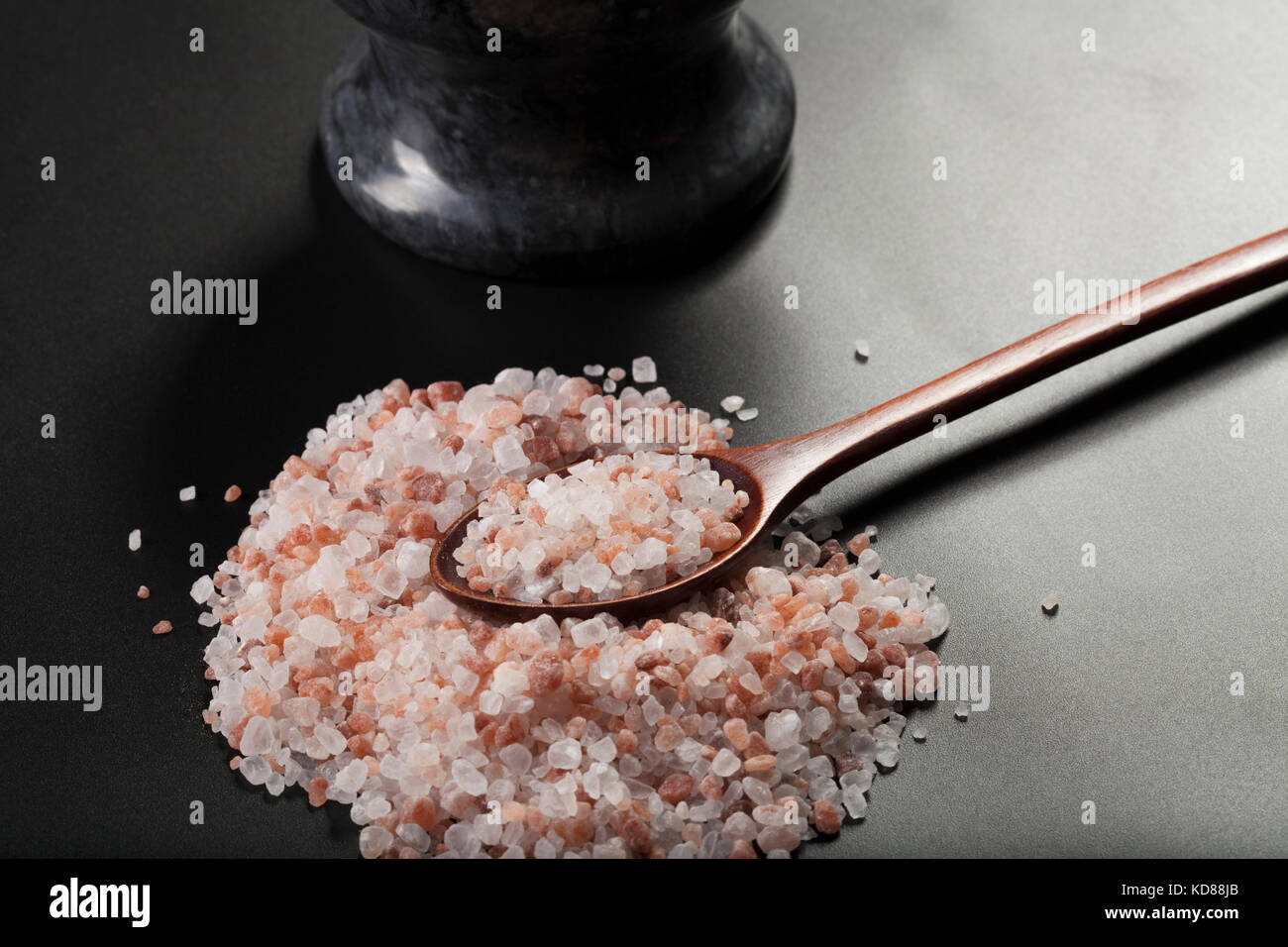 Pink Himalayan Salt Pile With Brown Wood Spoon and Mortar Close-up ...