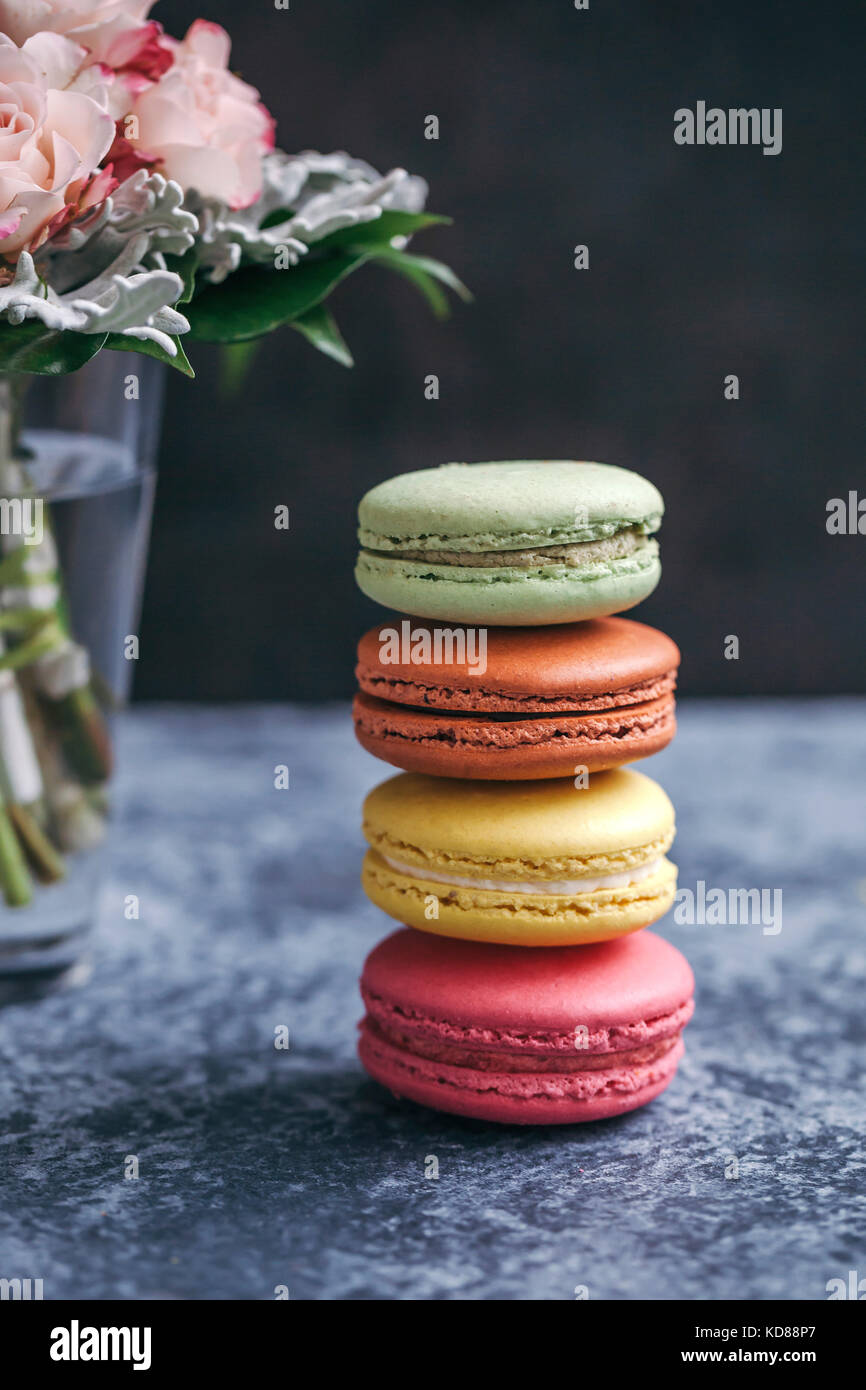 Stack of colorful macarons on grey background Stock Photo - Alamy