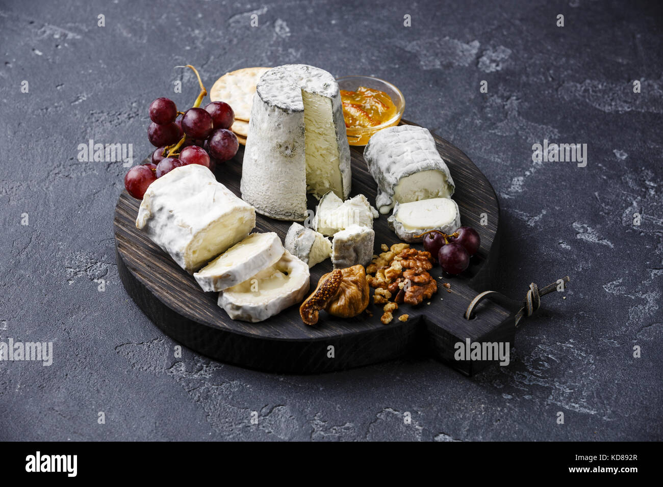 Goat Cheese board Snack assortment with confiture and grape on cutting ...