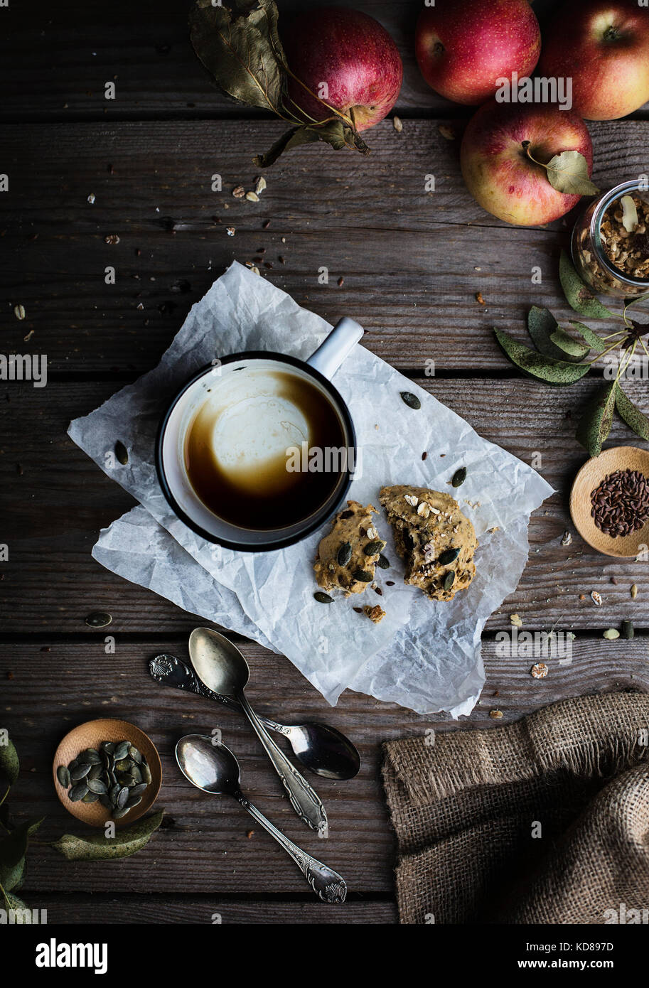 Pastry and cup of coffee on rustic wooden table. Top view breakfast ...