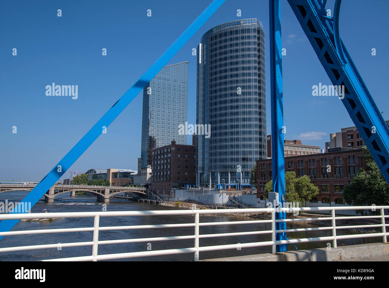 city buildings framed in blue steel bridge framework in Michigan Stock ...