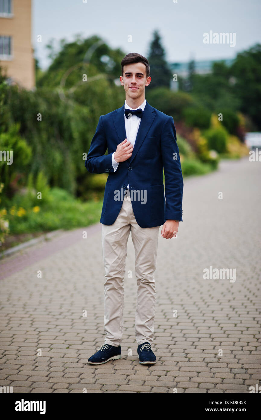 Portrait of a handsome young man in formal fancy suit posing on the ...