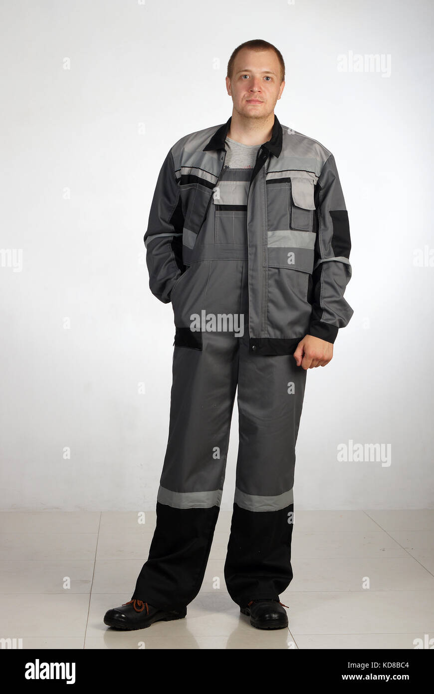 A man in overalls and work wear.Isolated studio portarit Stock Photo ...