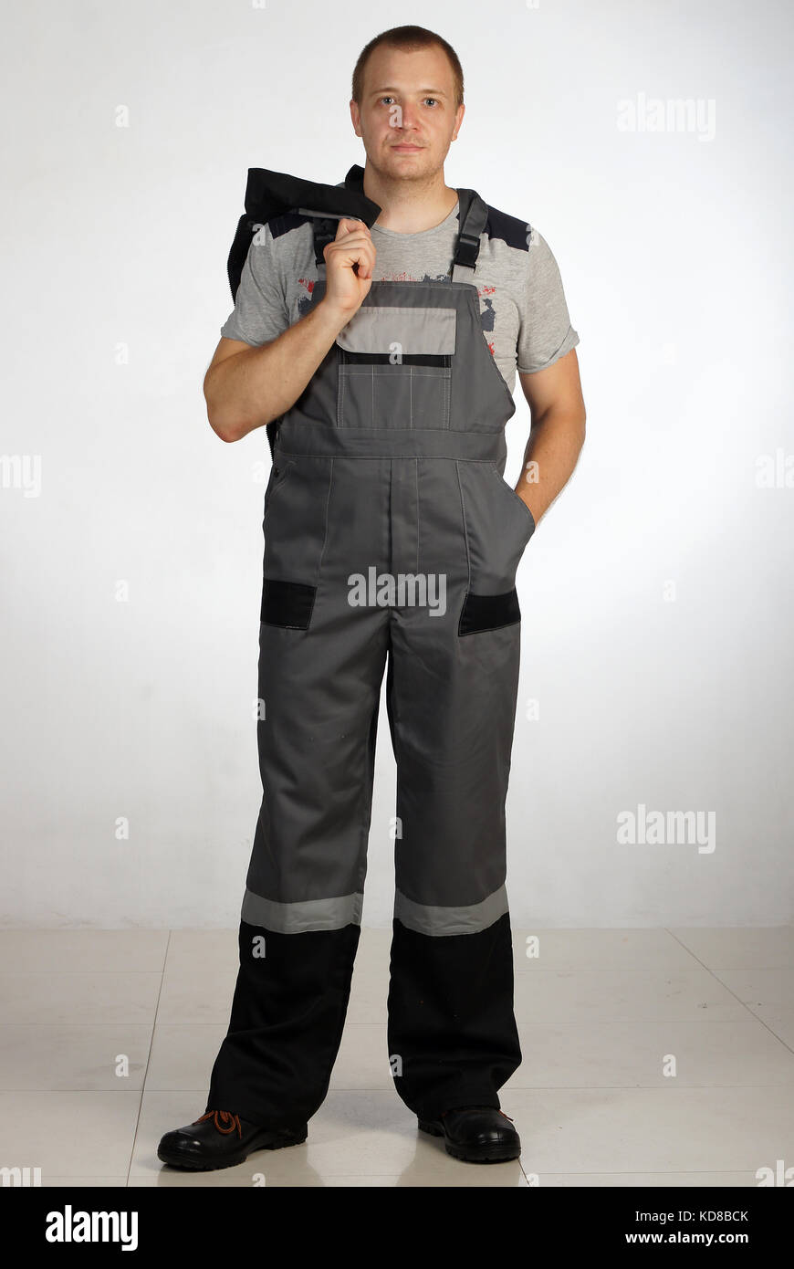 A man in overalls and work wear.Isolated studio portarit Stock Photo ...