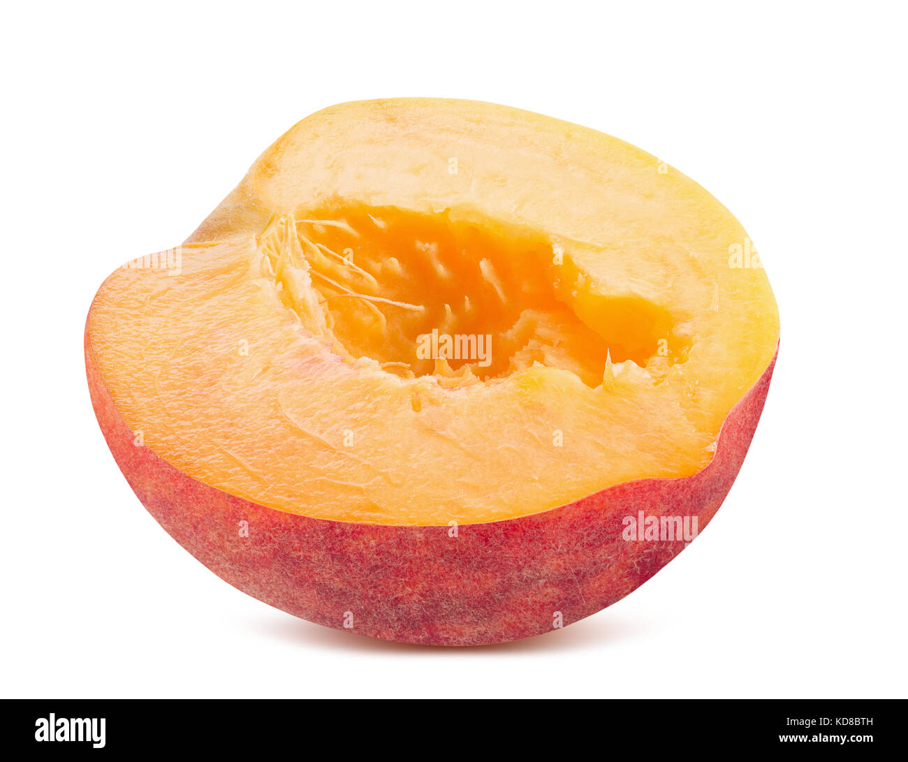 half of peach isolated on a white background Stock Photo - Alamy