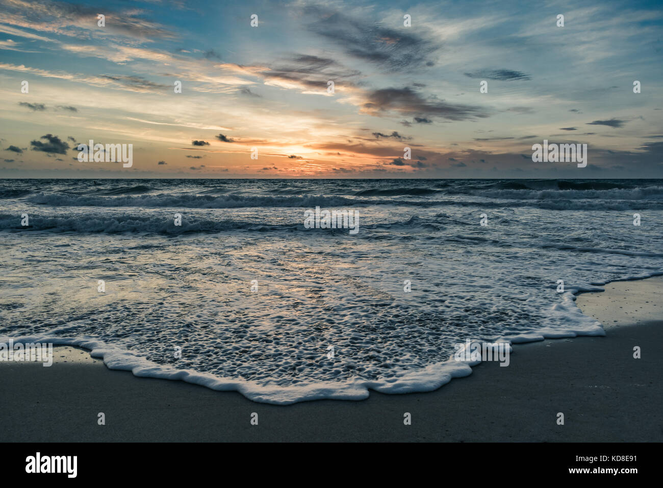 blue morning at the beach as the sun rises and the tides change Stock ...