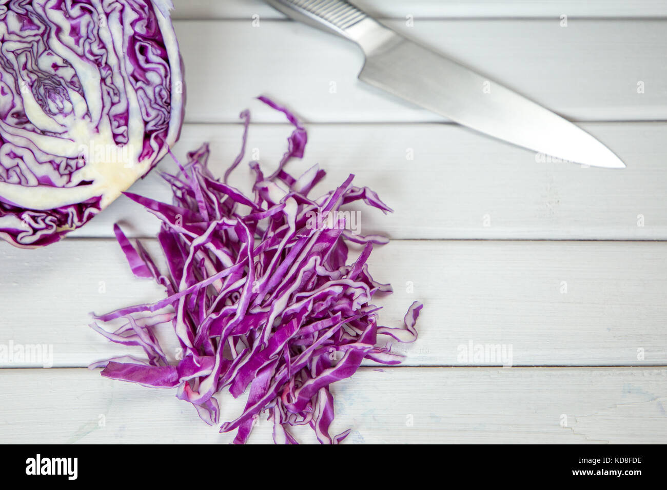 choped Red Cabbage on Wooden Cutting Board with knife Stock Photo - Alamy