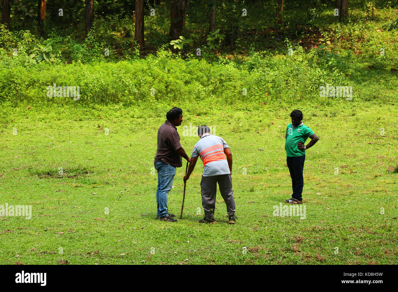 Happy friends spending time together outside in green nature Stock ...