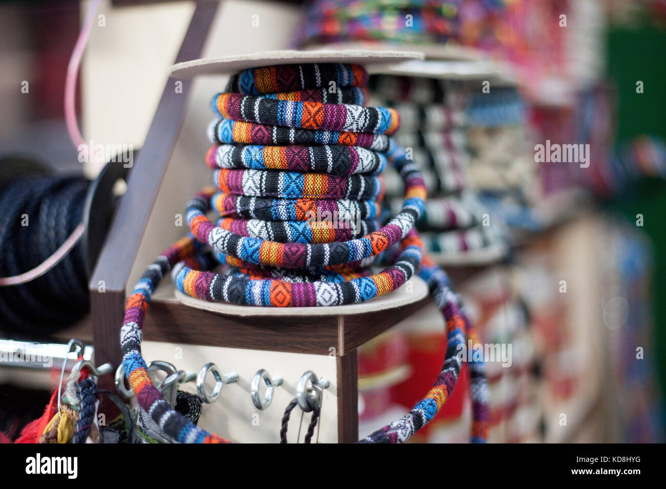 A roll of colorful rope of cotton hanging on a shelf of a shop Stock ...