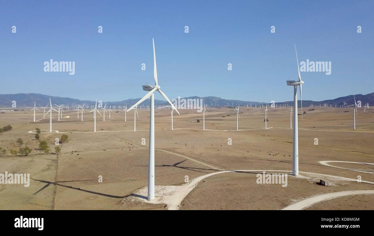 Windmills in desert Stock Photo - Alamy